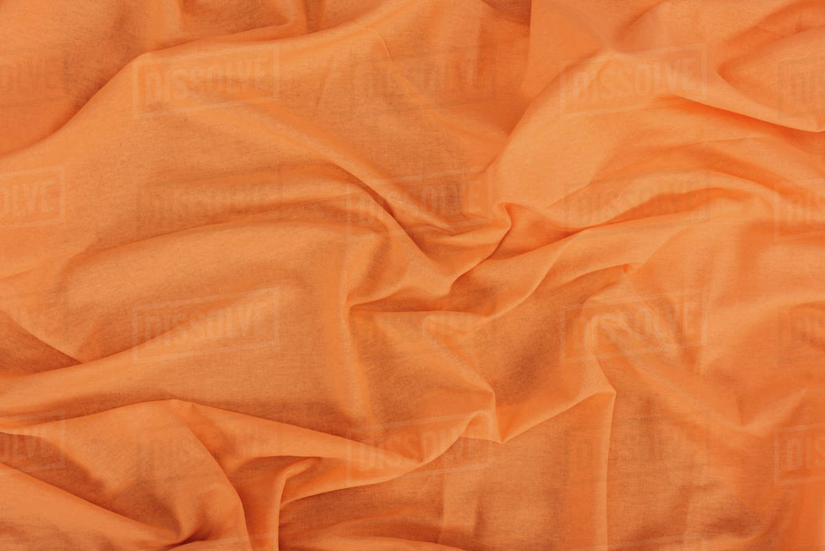 close up view of orange linen fabric texture - Stock Photo - Dissolve