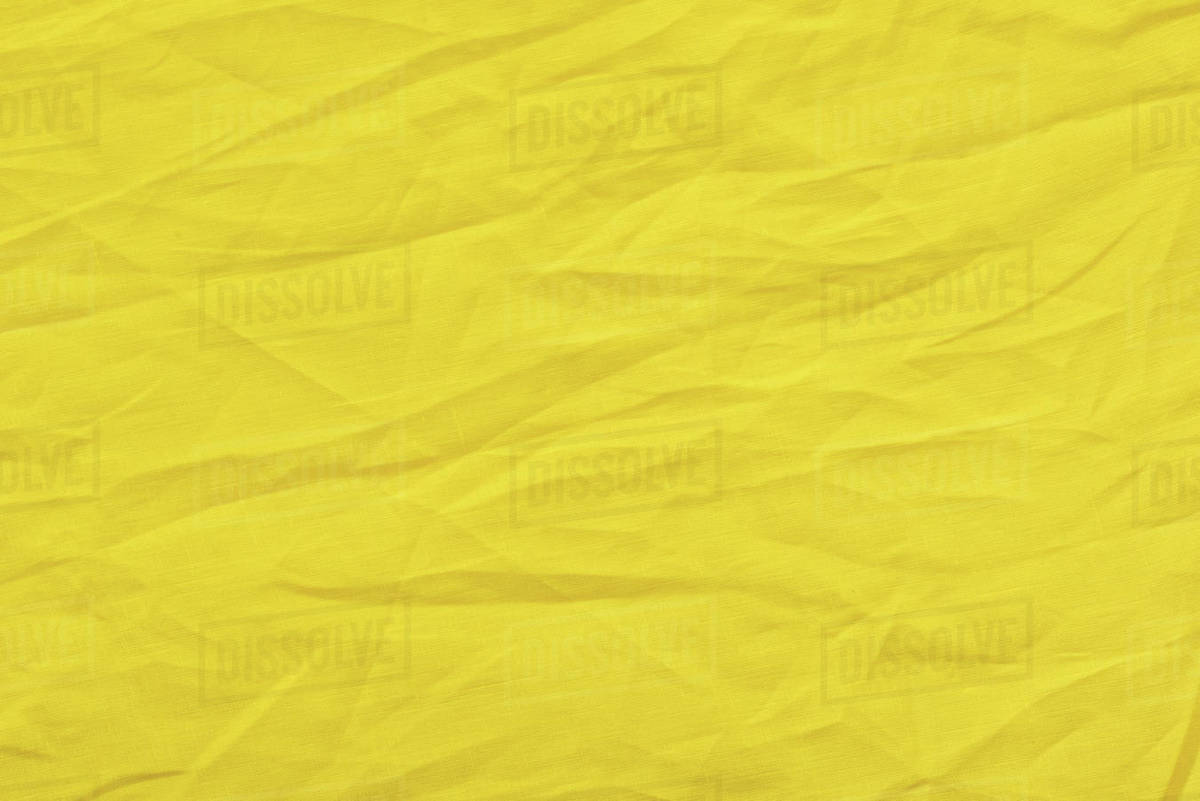 close up view of yellow linen fabric texture - Stock Photo - Dissolve
