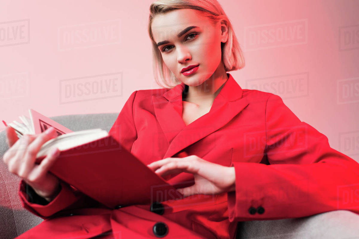 Beautiful elegant stylish girl reading book, on pink - Royalty-free ...