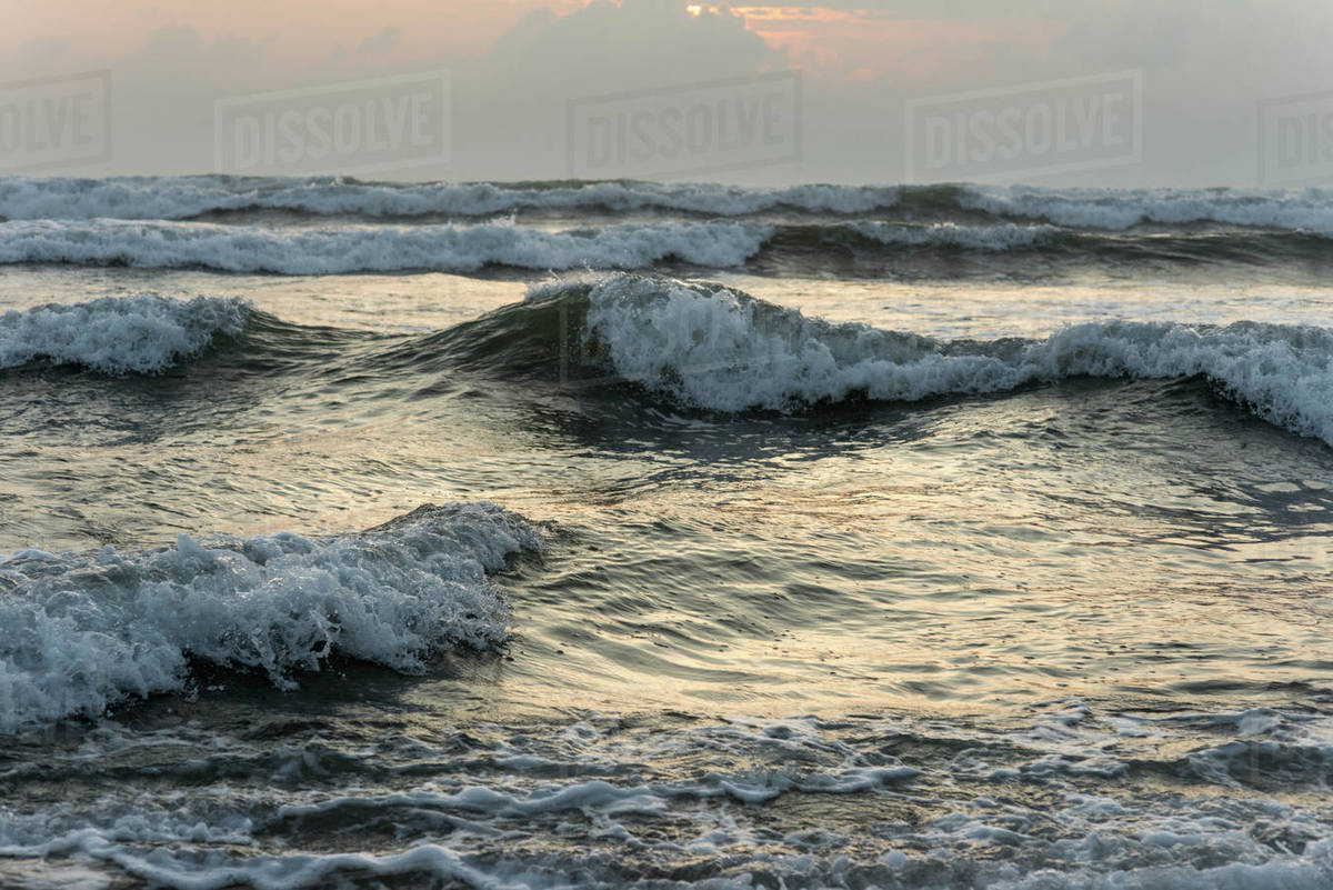 Beautiful wavy sea on summer evening - Royalty-free Stock Photo | Dissolve