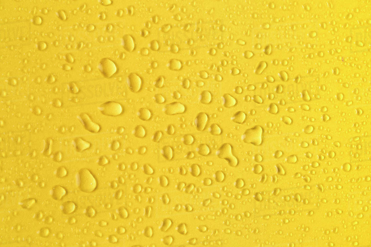 Different Water drops isolated on yellow - Stock Photo - Dissolve