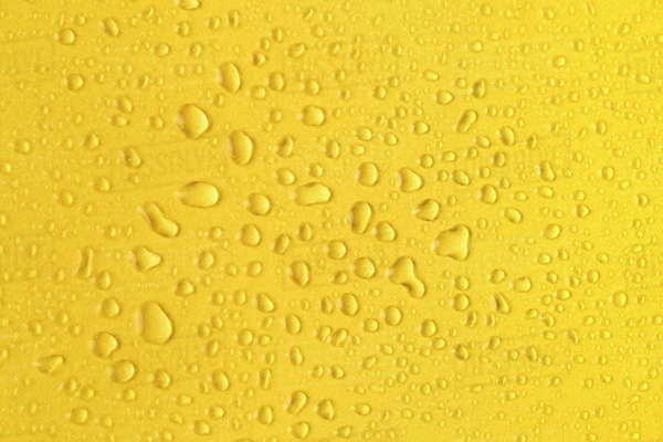 Different Water drops isolated on yellow - Stock Photo - Dissolve