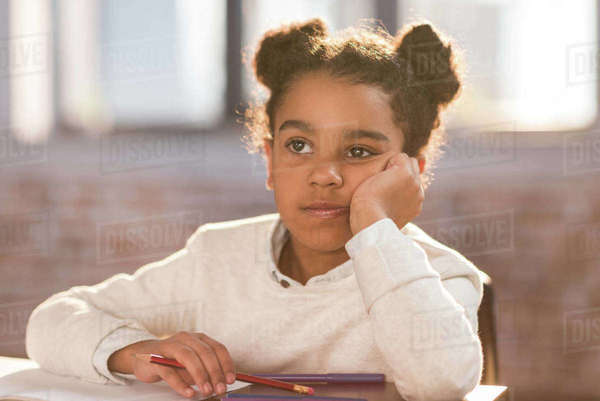 Portrait of adorable little elementary school student holding pencil ...
