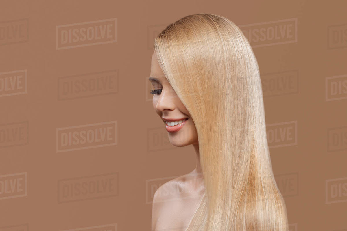 Side view of beautiful girl with blonde long hair and closed eyes ...