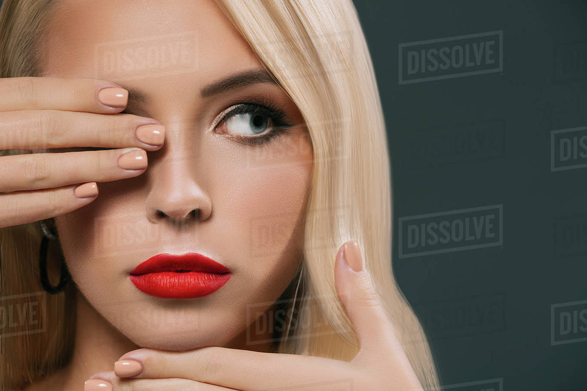 Beautiful woman closing eye, isolated on grey - Royalty-free Stock ...
