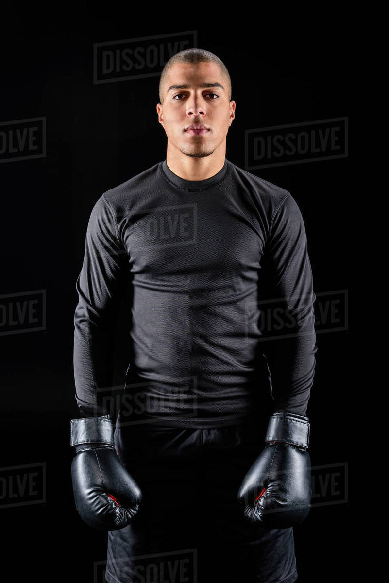 african american boxer standing isolated on black - Stock Photo - Dissolve