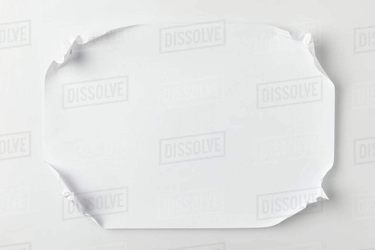 Top view of paper with crumpled corners on white surface - Royalty-free ...