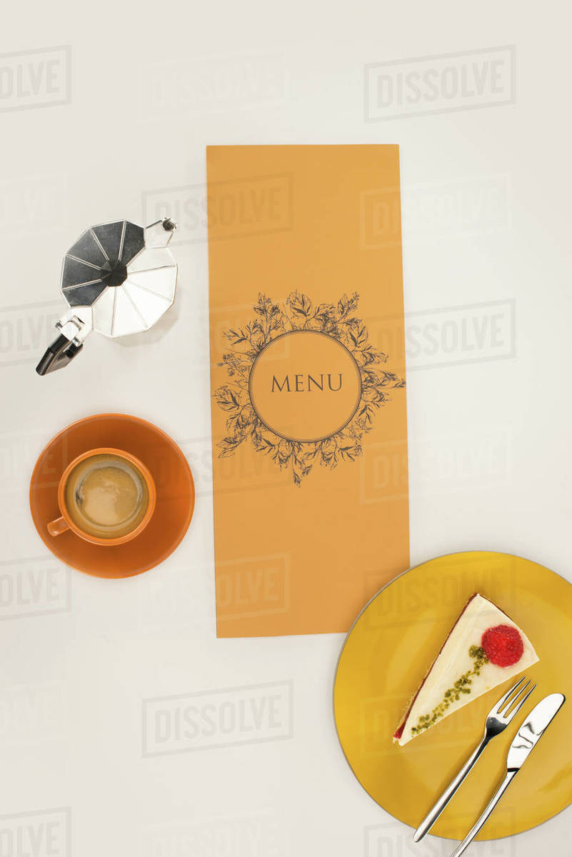 Top view of decorative menu with coffee and dessert on white - Stock ...