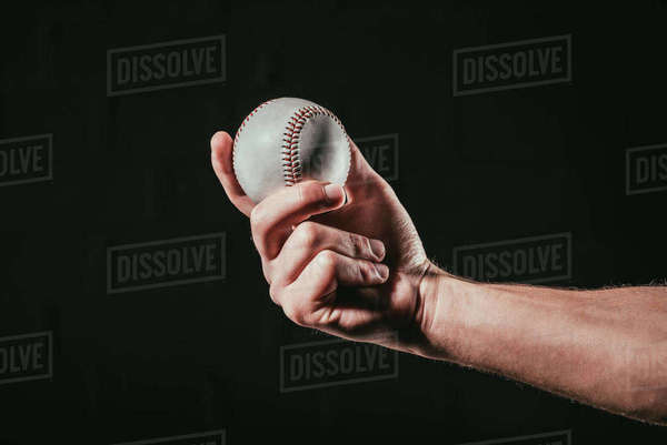 Close-up partial view of male hand holding baseball ball isolated on ...