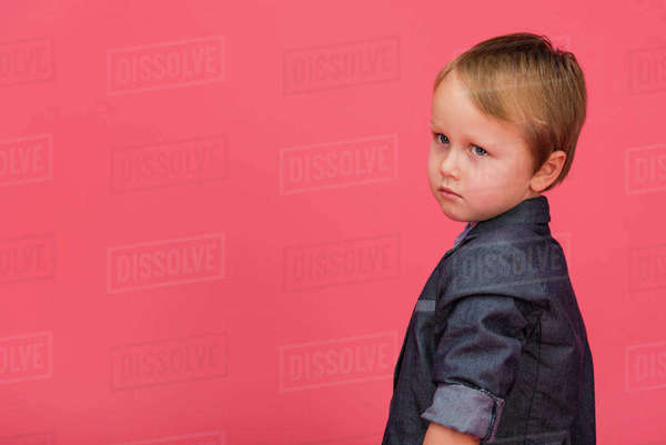 side view of adorable little boy isolated on pink - Royalty-free Stock ...