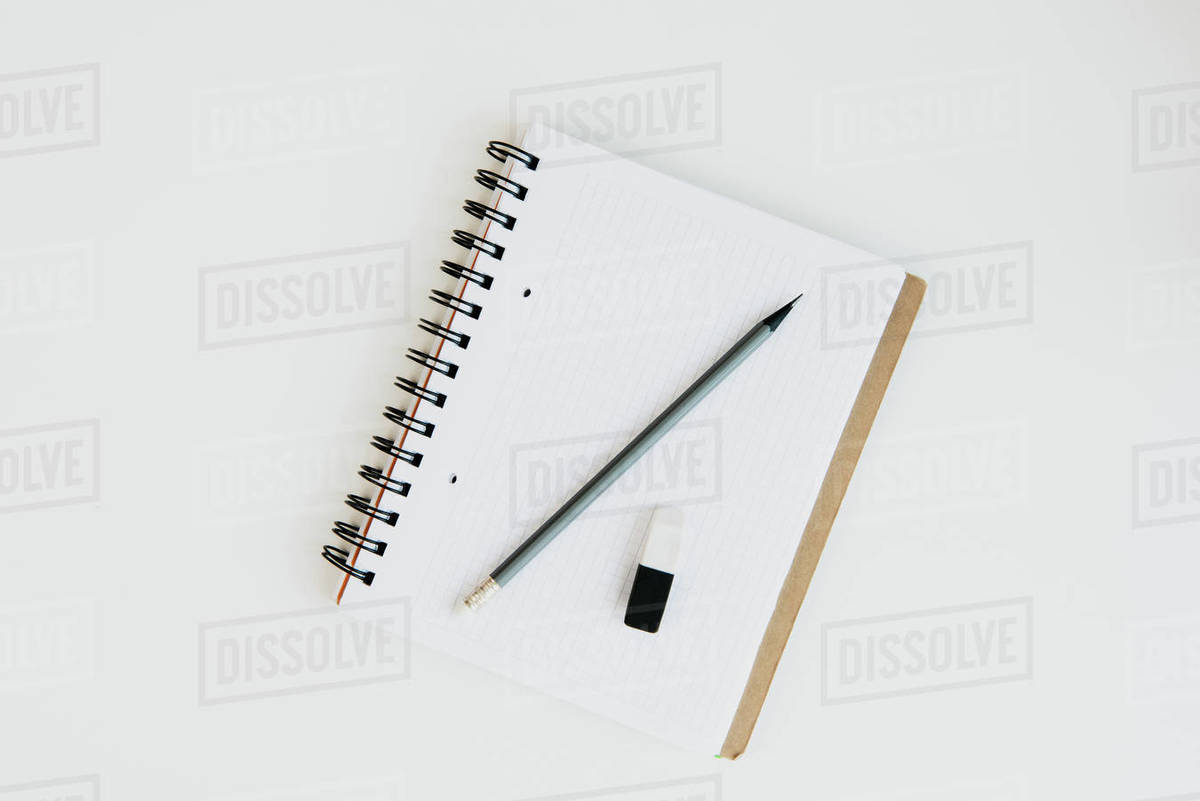 Top view of notebook with pencil and rubber on table top - Royalty-free ...
