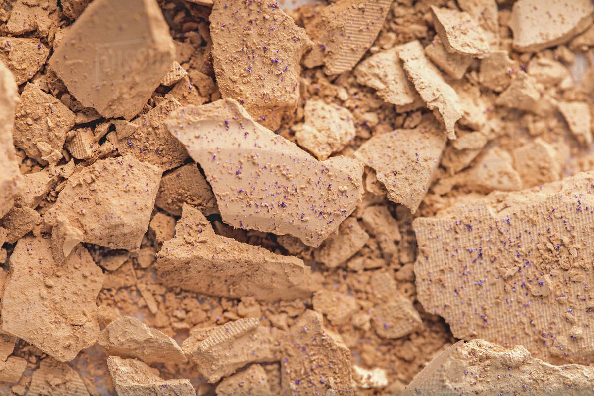 Top view of crushed cosmetic powder as background - Stock Photo - Dissolve