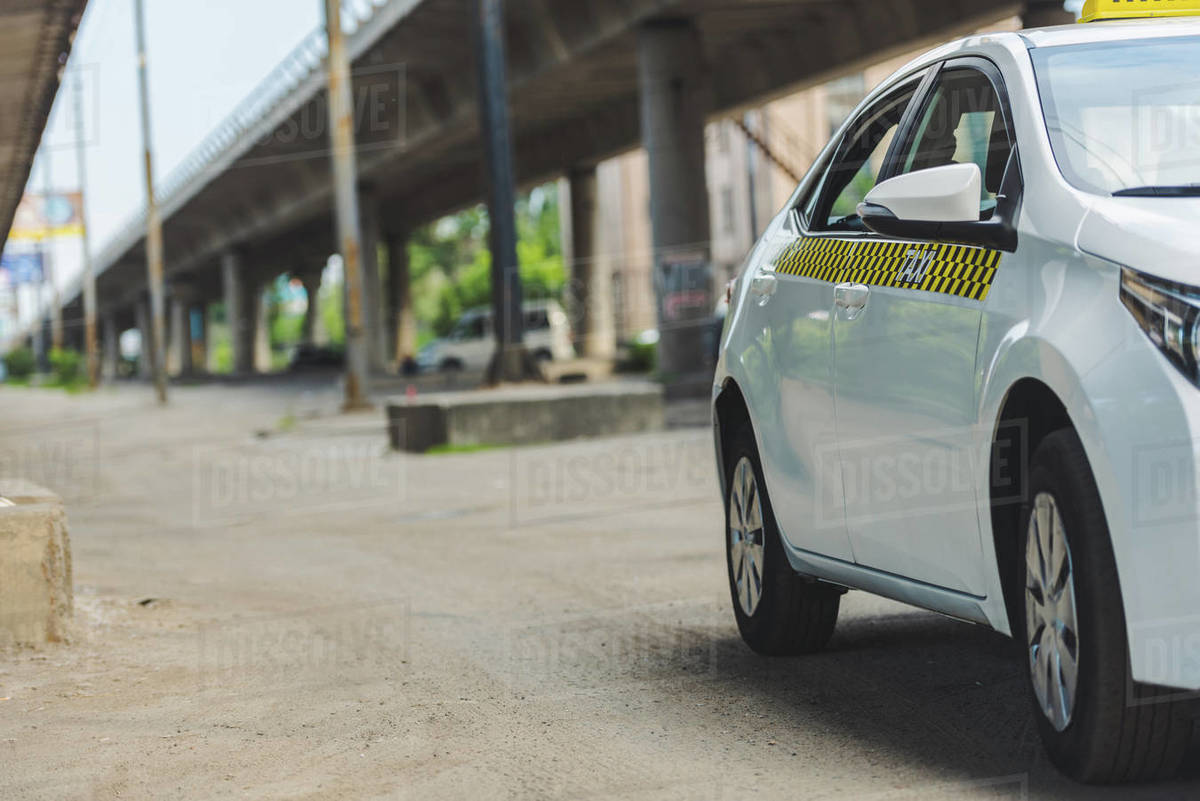 White shiny taxi cab with yellow sign on street - Royalty-free Stock ...
