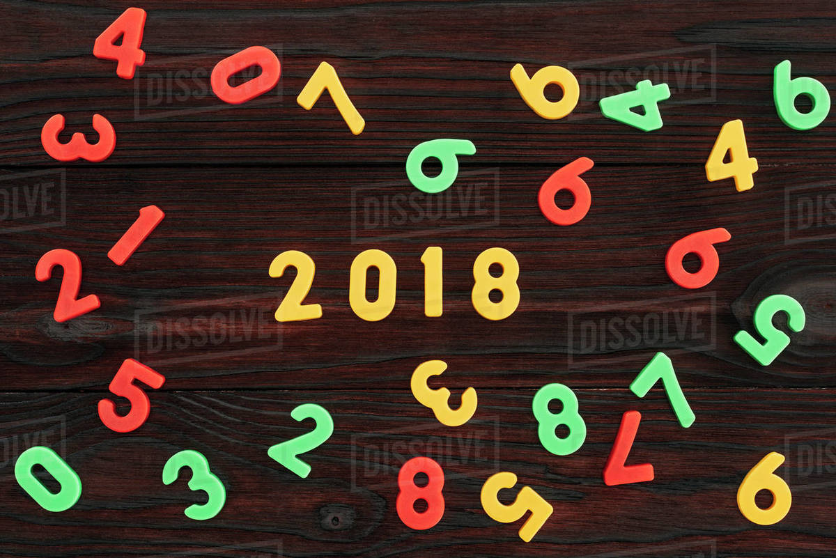 Top view of colorful 2018 numbers on dark wooden surface - Stock Photo ...