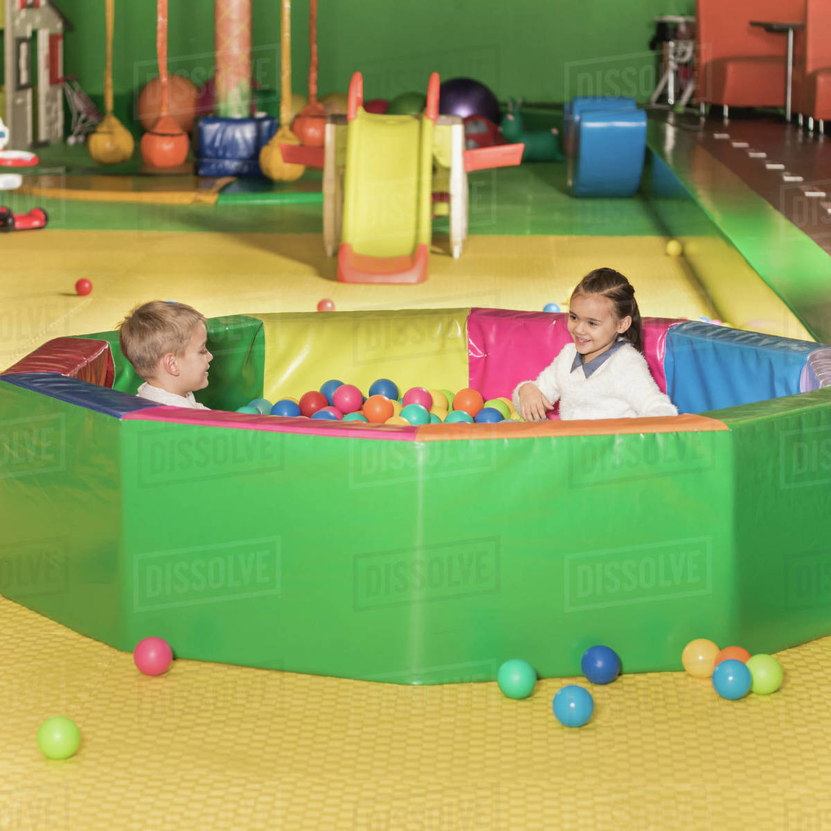 adorable happy little children playing in pool with colorful balls ...