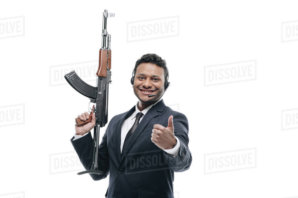 African american bodyguard with rifle and headset showing thumb up ...