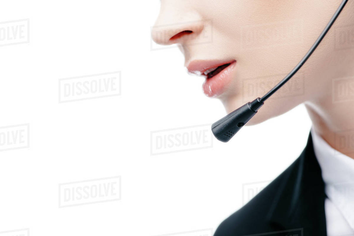 Cropped view of female operator working with headset, isolated on white ...