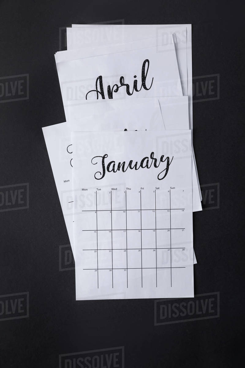 Top view of arranged parts of paper calendar isolated on black ...