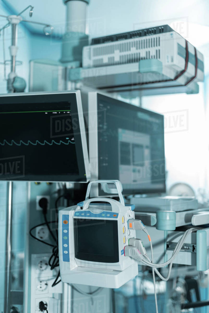 Medical equipment with screens in surgery room - Stock Photo - Dissolve