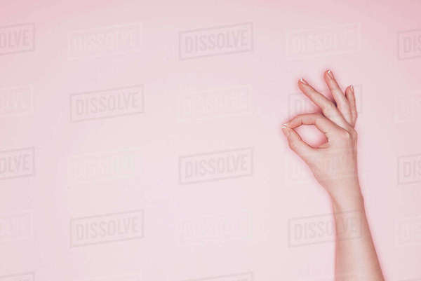 Cropped shot of woman showing okay sign isolated on pink - Royalty-free ...