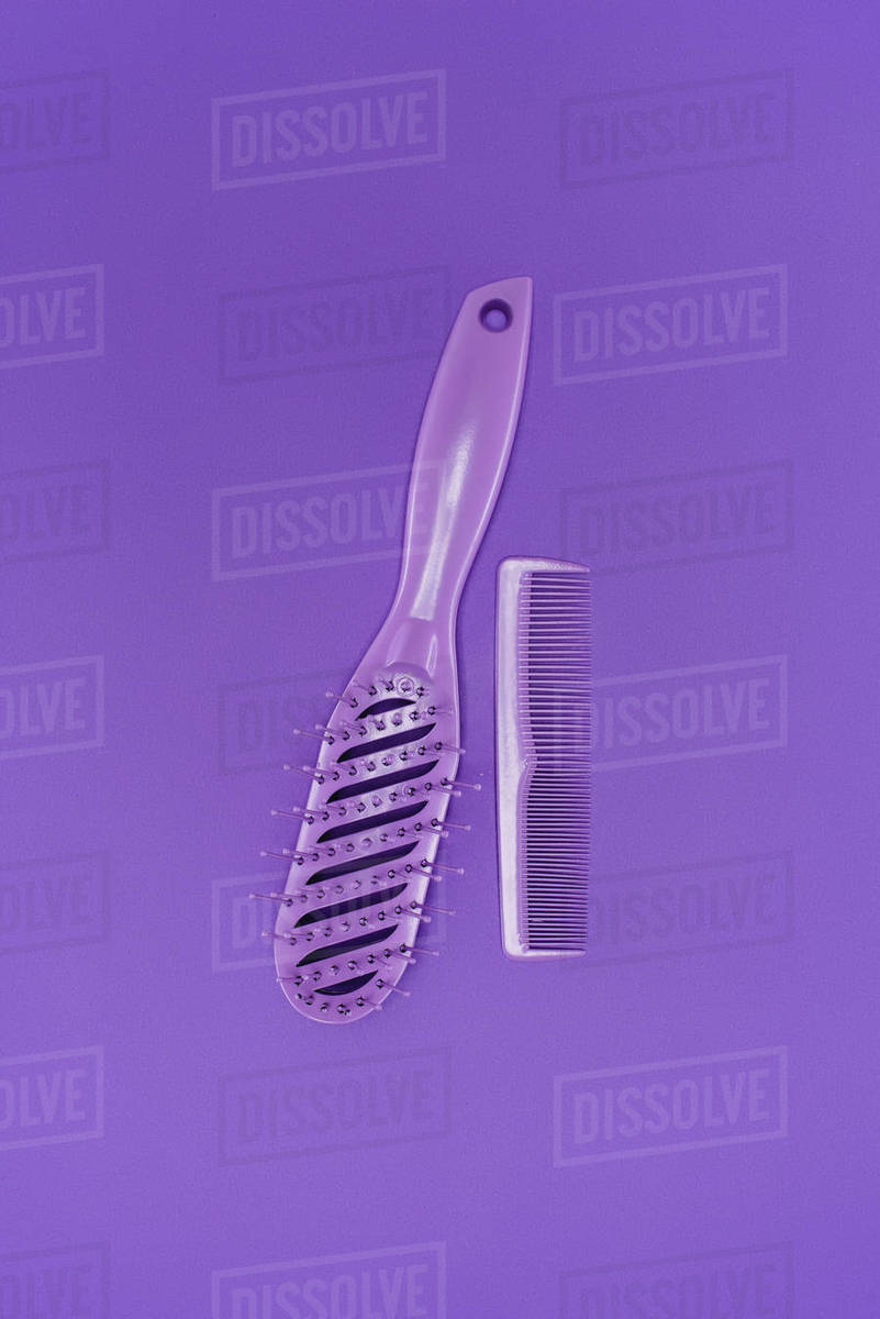 Close up view of purple combs isolated on purple - Royalty-free Stock ...
