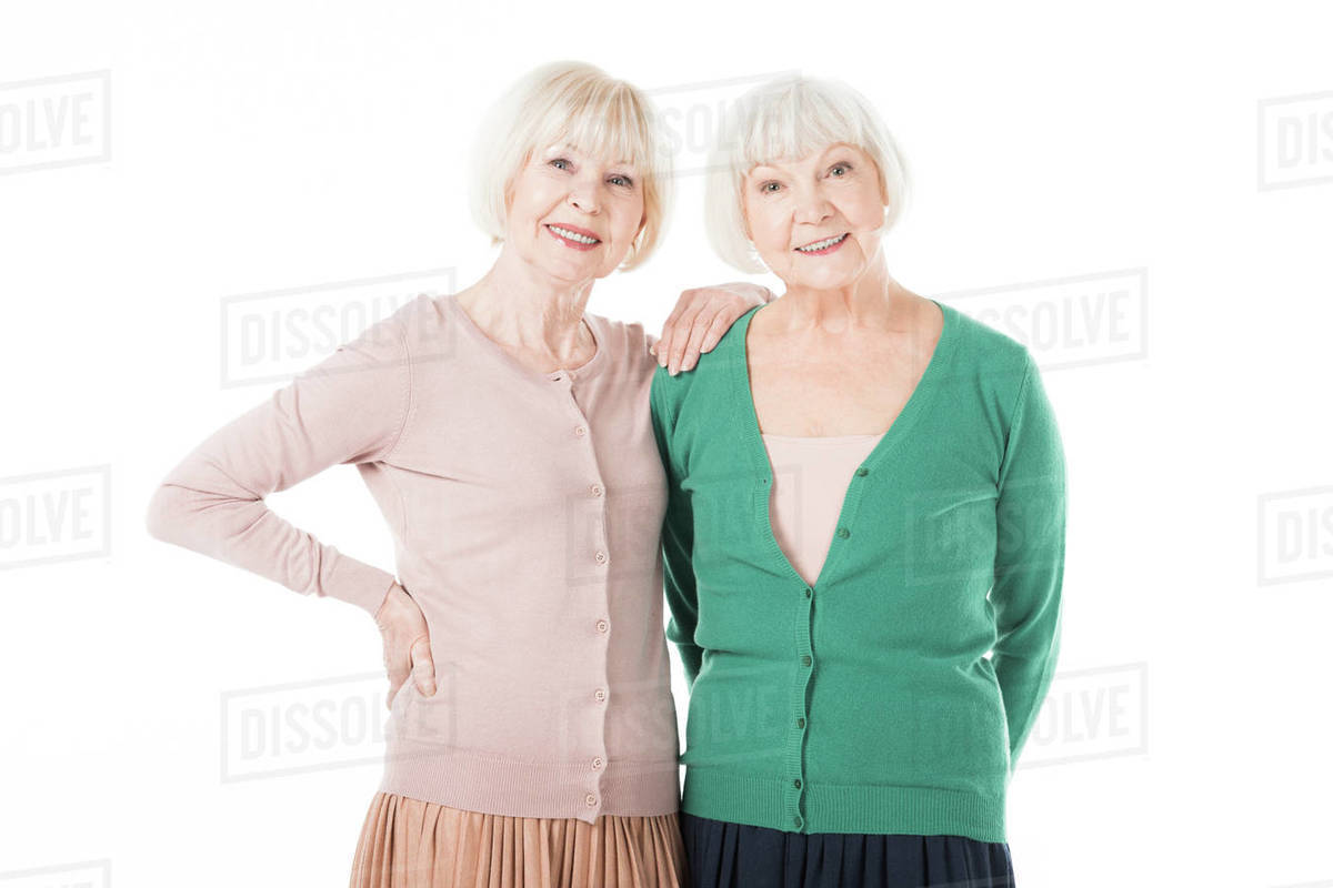 Two stylish senior women standing isolated on white - Royalty-free ...