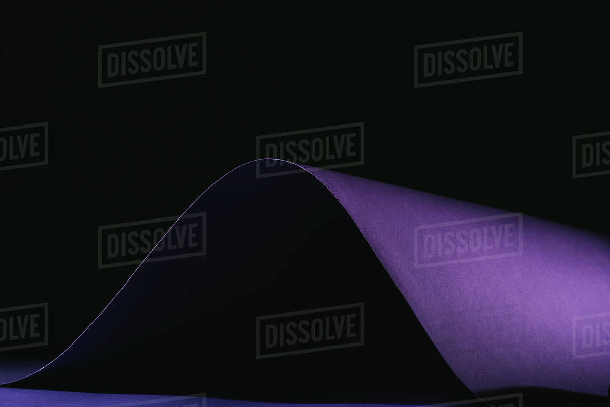 Warping simple purple paper on black - Royalty-free Stock Photo | Dissolve