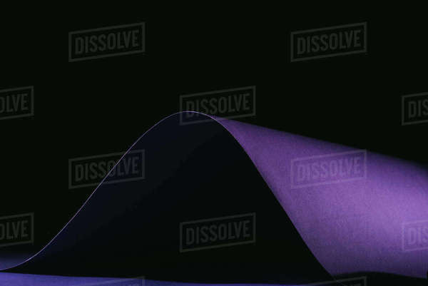 Warping simple purple paper on black - Royalty-free Stock Photo | Dissolve