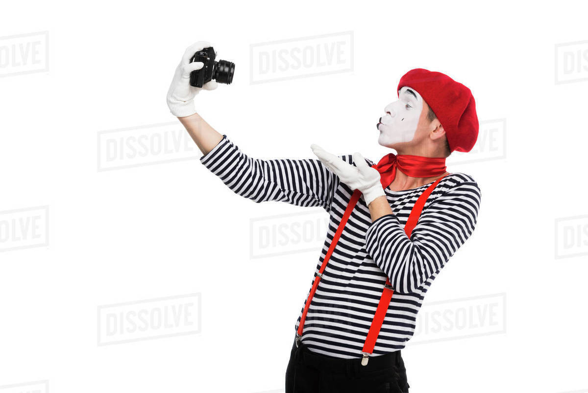 Mime taking selfie with film camera and sending air kiss isolated on ...