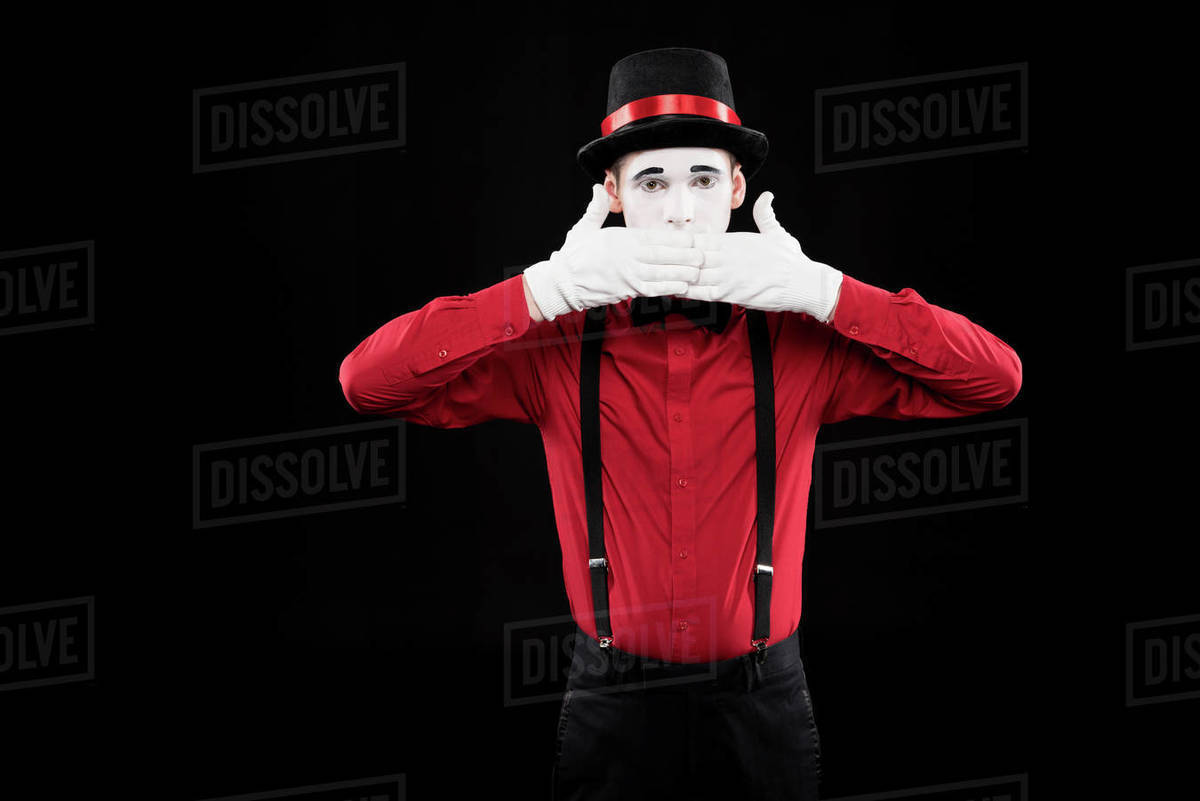 Mime covering mouth with hands isolated on black - Royalty-free Stock ...