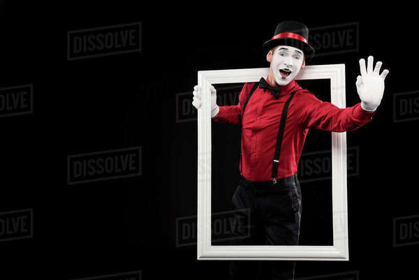 Happy mime waving hand from frame isolated on black - Royalty-free ...