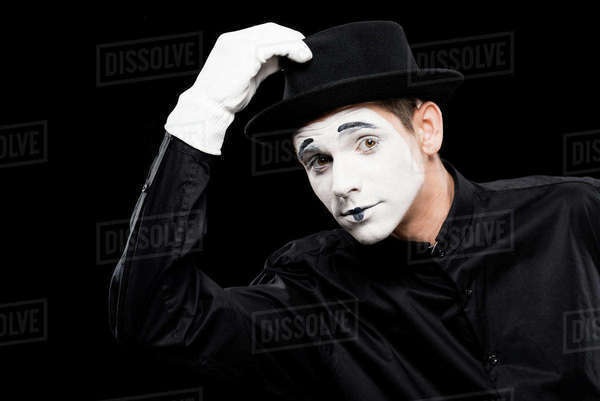 Mime greeting and touching hat isolated on black - Royalty-free Stock ...