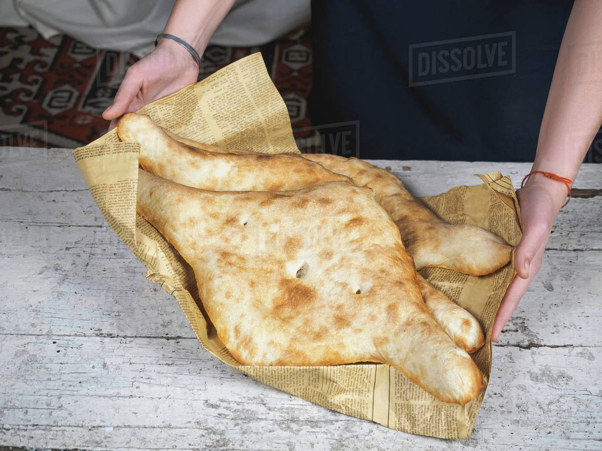 Cropped shot of person wrapping delicious traditional Georgian ...