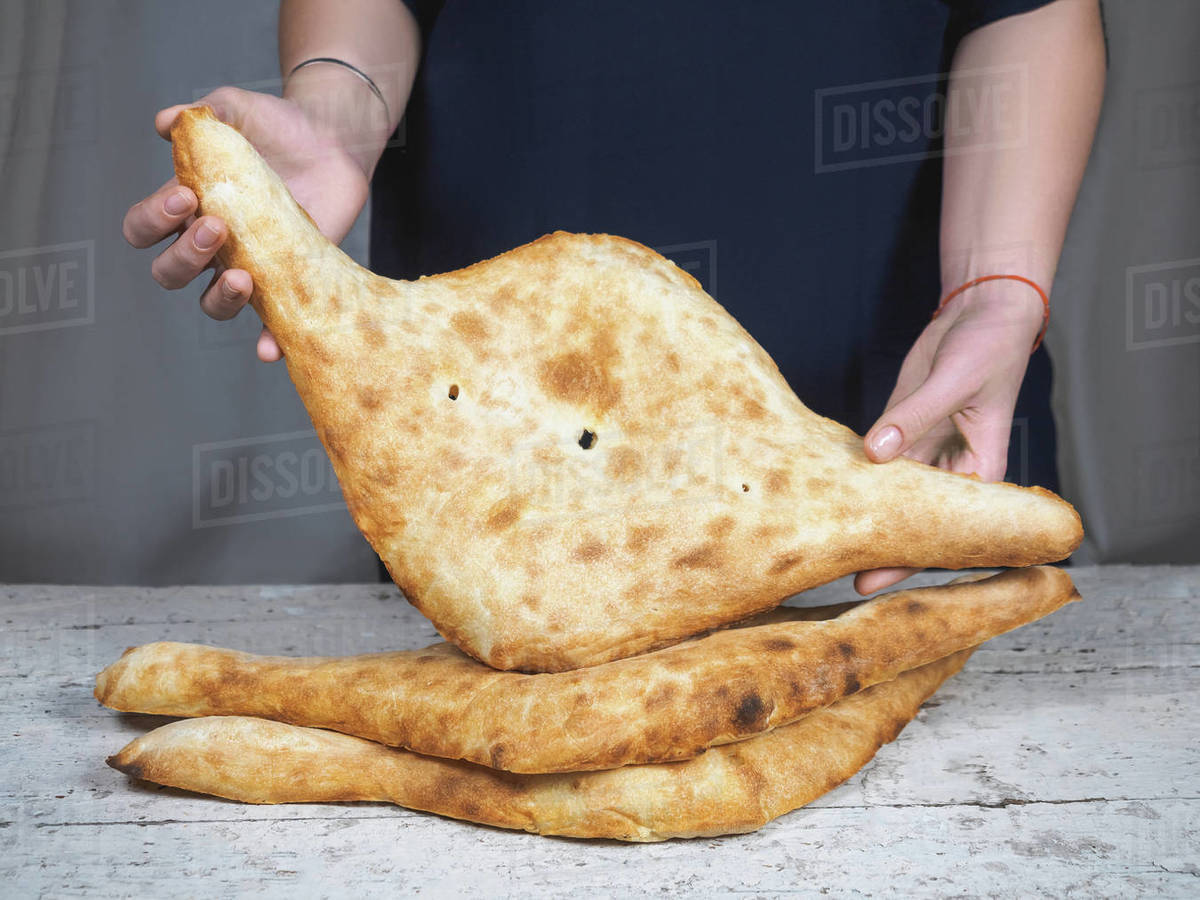 Close-up partial view of person holding delicious traditional Georgian ...