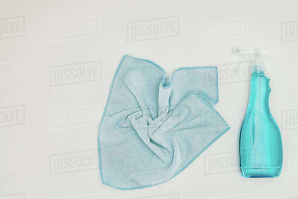Top view of blue rag and spray bottle isolated on white - Royalty-free ...