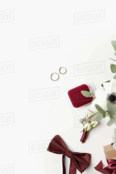 Flat lay with gift, buttonhole, bow tie and jewelry box isolated on ...