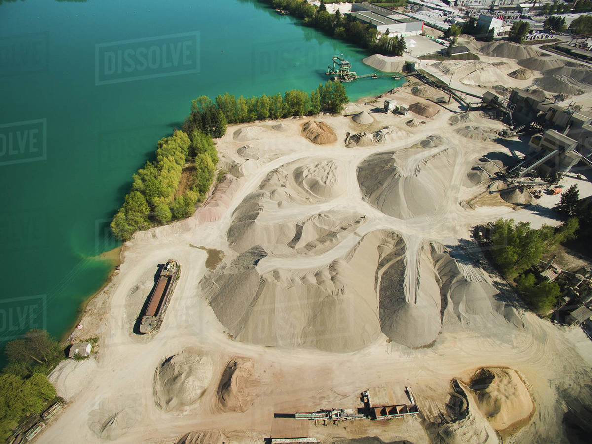 Aerial view of sand quarry or construction at river, Germany - Royalty ...