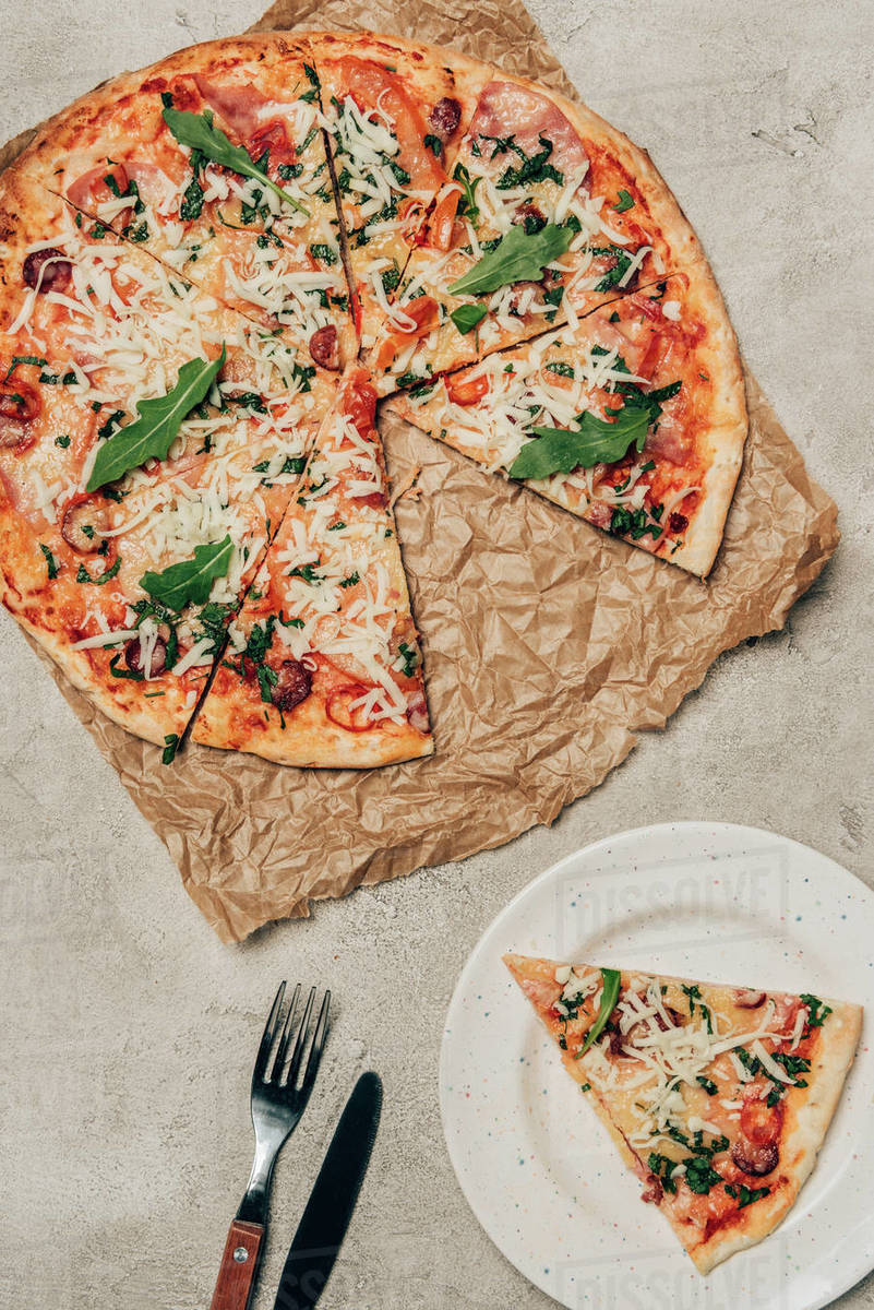 Pizza slice and whole pizza on light background - Royalty-free Stock ...