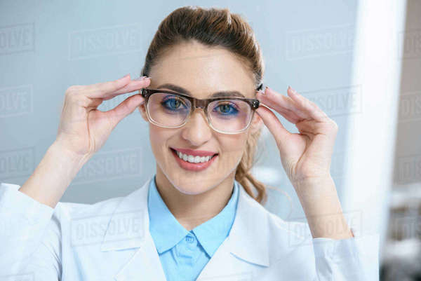Attractive smiling ophthalmologist wearing eyeglasses - Royalty-free ...