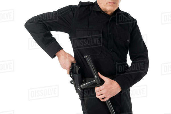 Close-up view of policeman in uniform pulling out gun isolated on white ...