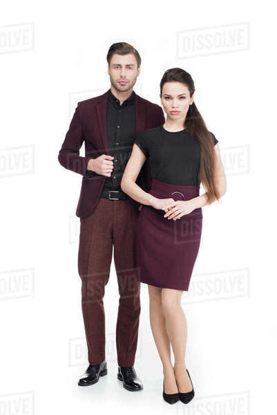 Beautiful serious couple standing together, isolated on white - Royalty ...