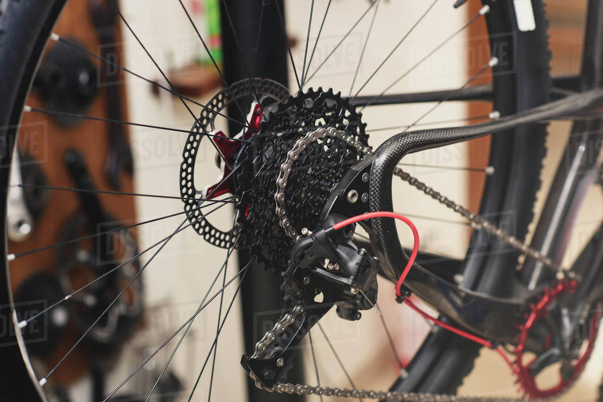 Close-up view of bicycle wheel with chain in workshop - Stock Photo ...