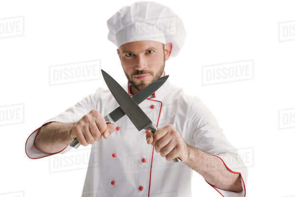 Handsome young chef sharpening knives isolated on white - Stock Photo ...