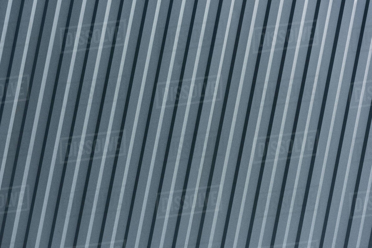 Industrial background of striped metal surface - Stock Photo - Dissolve