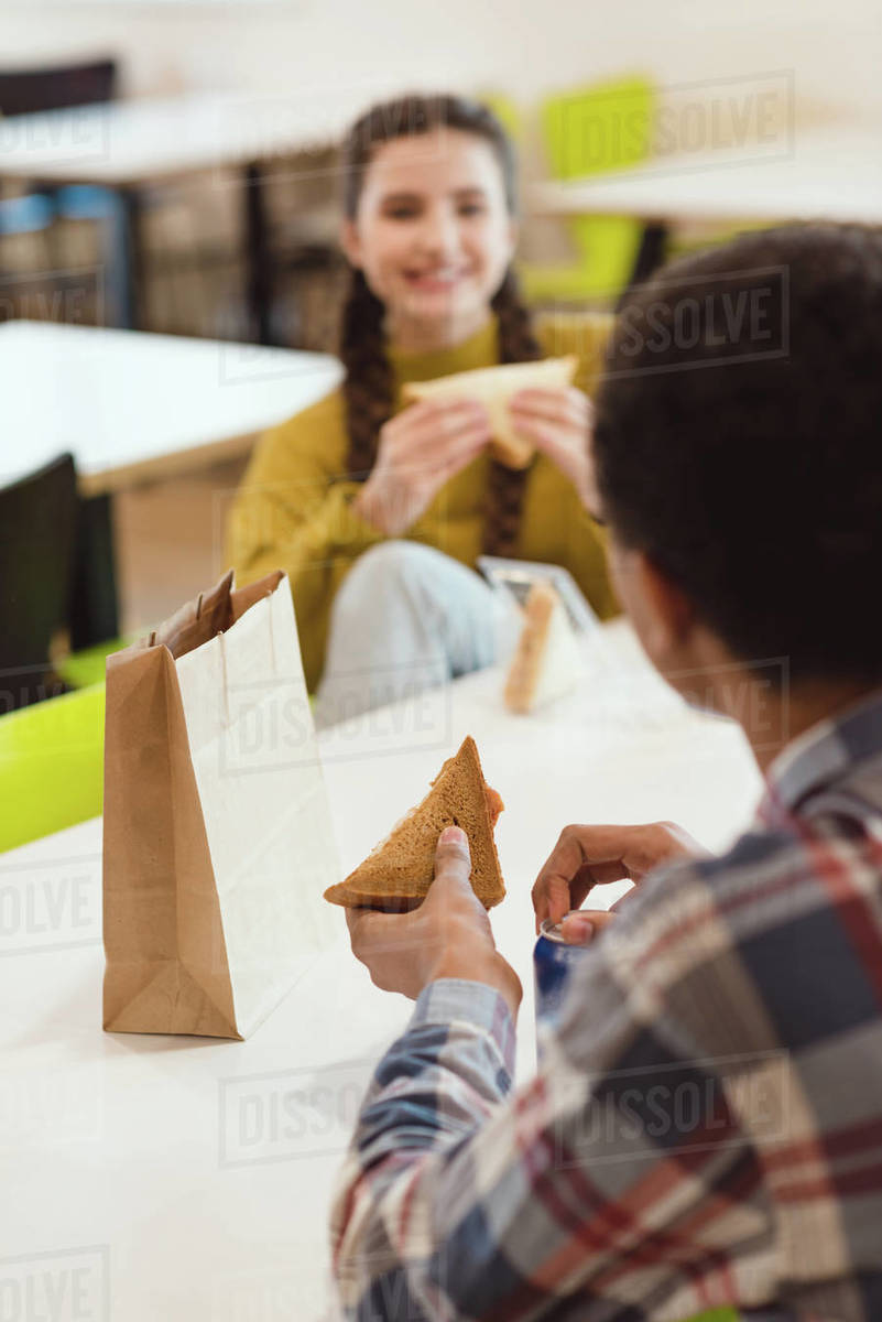 High school students eating sandwiches at school cafeteria - Stock ...