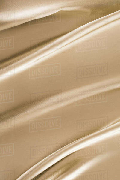 Beige shiny satin fabric background - Royalty-free Stock Photo | Dissolve