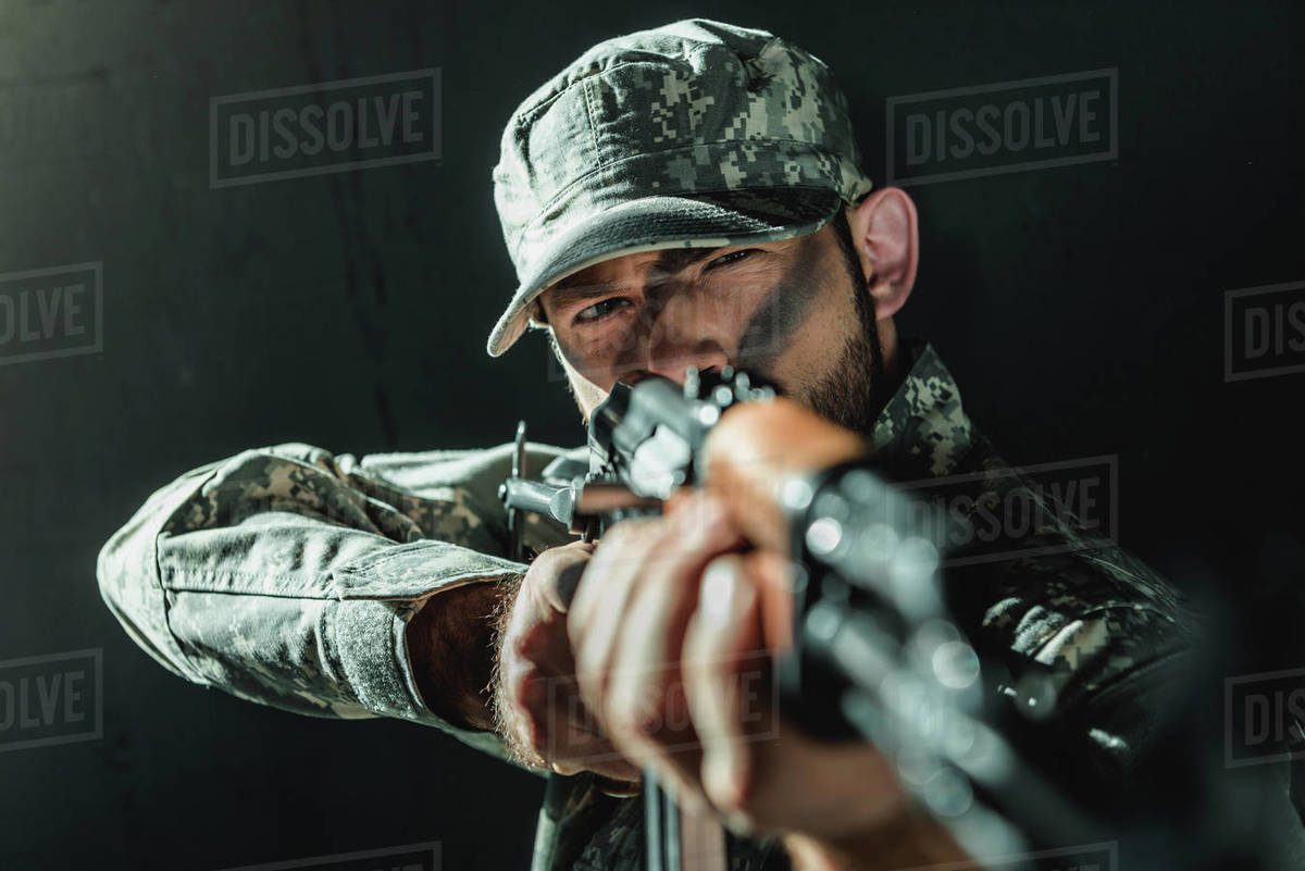 close-up shot of soldier in military uniform with rifle isolated on ...