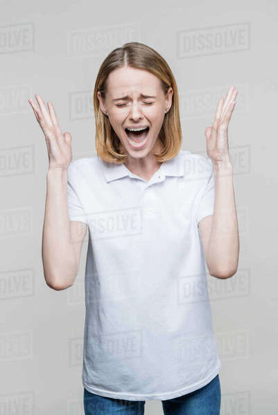 Attractive stressed woman yelling isolated on grey - Royalty-free Stock ...