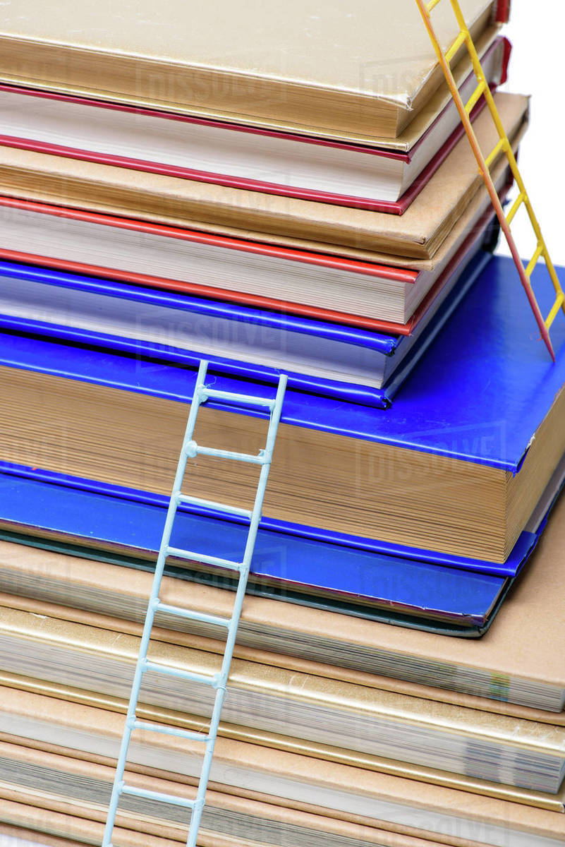 Stack of books with ladders isolated on white, educational concept ...