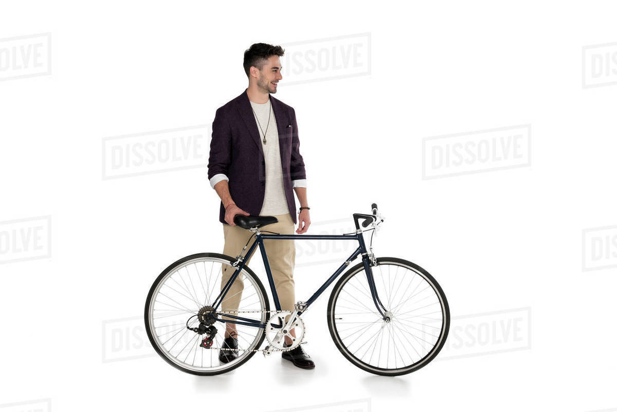 Full length view of handsome stylish young man standing with bicycle ...